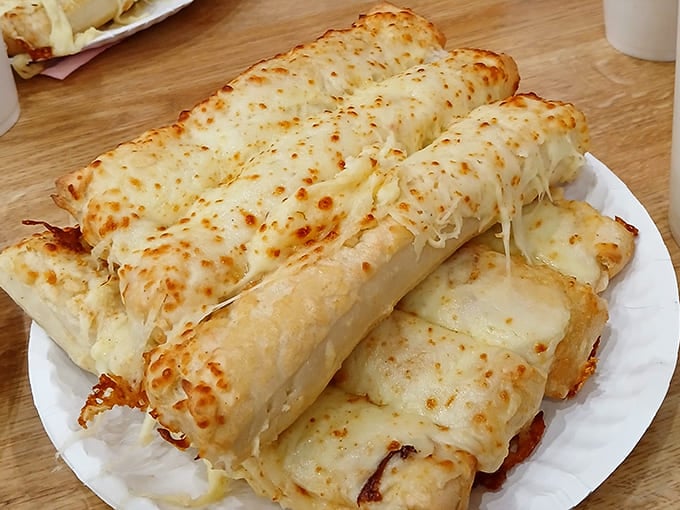 These aren't your average breadsticks &ndash; they're golden wands of garlicky, cheesy goodness that threaten to upstage the main course.