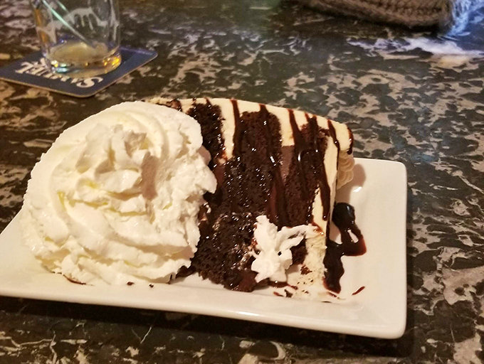 A decadent slice of chocolate cake with whipped cream pairs perfectly with the rich, malty notes of a properly poured Guinness. 