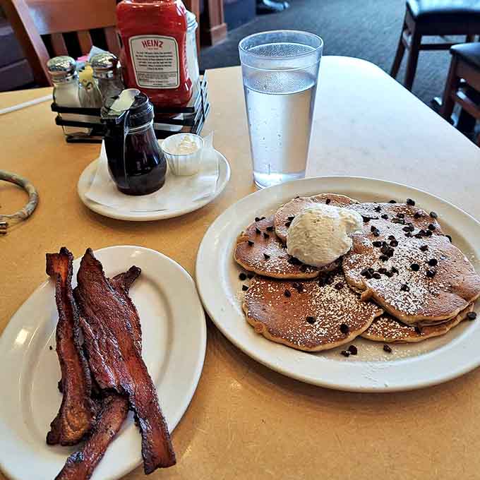 Chocolate chip pancakes with crispy bacon &ndash; the breakfast equivalent of wearing a tuxedo t-shirt: formally delicious yet comfortably indulgent.