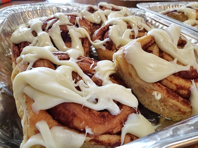 Cinnamon sticky buns that glisten with sweet rebellion against sensible eating &ndash; cream cheese frosting melting into warm, spiraled pastry that's worth every delicious calorie.