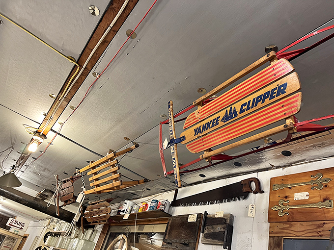 The "Yankee Clipper" sled hangs from the ceiling, conjuring images of snowy hills and childhood winters long before video games existed.