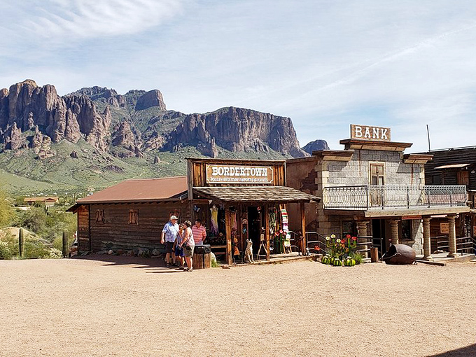 Visitors browse for treasures at the Bordello gift shop while the imposing Superstition Mountains loom in the background.