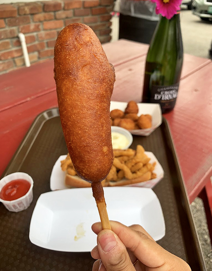 Nostalgia on a stick &ndash; a carnival classic elevated with housemade cornmeal batter that shatters perfectly with each bite.