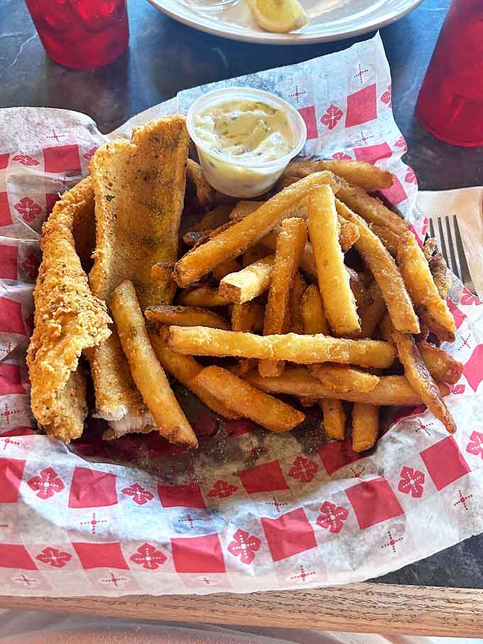 Fresh-caught fish and hand-cut fries served in a red-checkered basket – simple food done so right it becomes extraordinary.