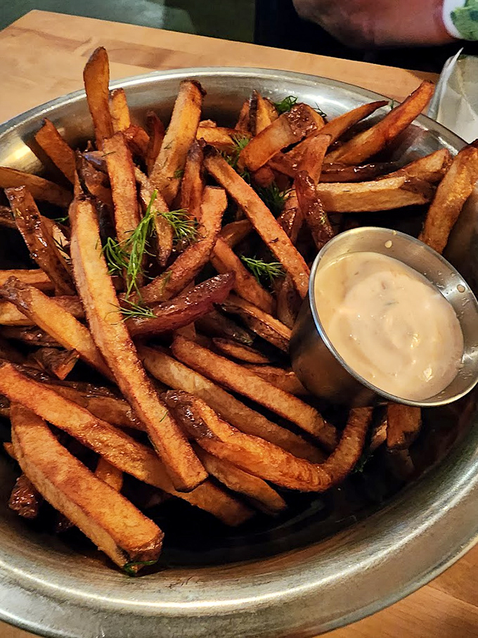 These aren't just any fries &ndash; they're hand-cut, double-fried treasures with crispy exteriors and fluffy centers that put frozen imposters to shame.