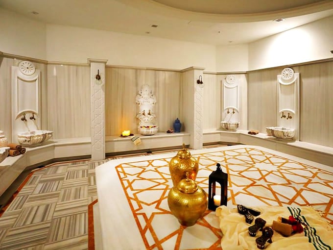 Marble Scrub Room: This gleaming chamber has witnessed more skin cells departing bodies than a sunburn convention in July.