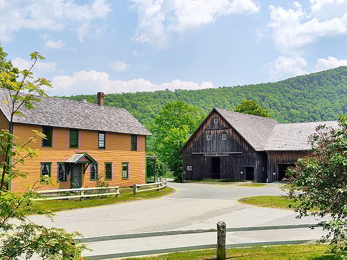 Vermont's picture-perfect rural landscape frames these historic buildings, creating a living postcard of early American farm life.