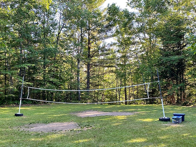Game point is always in dispute at Brighton's volleyball court, where competitive spirits soar among friends while surrounded by whispering pines.