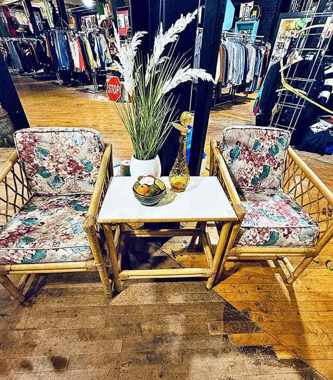 Mid-century rattan meets floral upholstery in this cozy conversation nook. The perfect spot to sip something tropical while discussing your latest vintage finds.