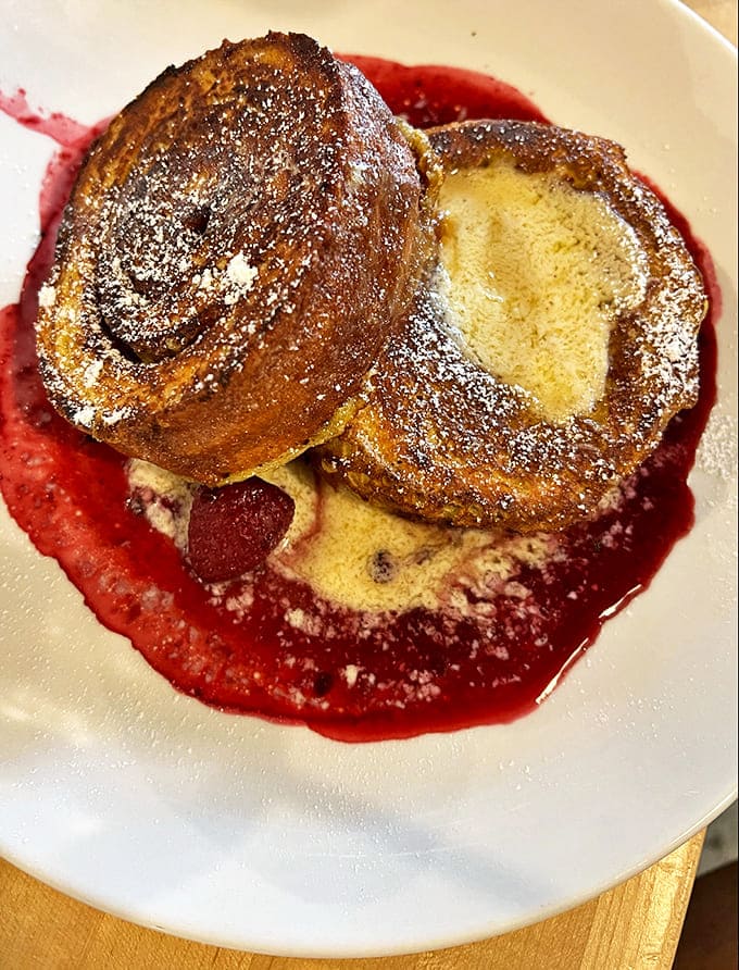 This stuffed French toast isn't just breakfast, it's dessert with morning privileges, swimming in berry compote and maple-kissed sweetness.