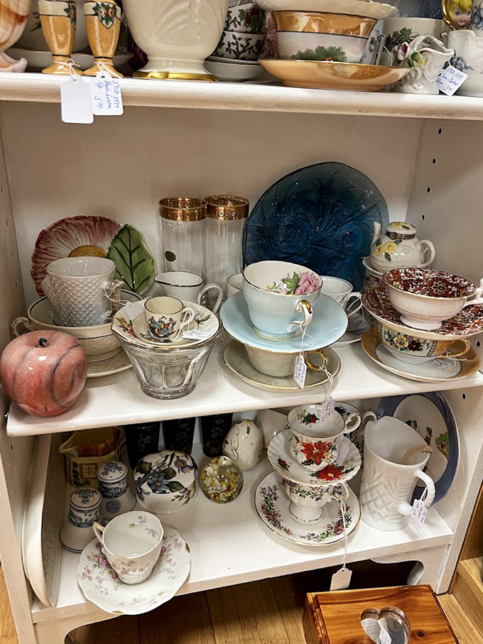 Tea sets from bygone eras stand ready for their next afternoon gathering, each cup and saucer telling stories of elegant social rituals.