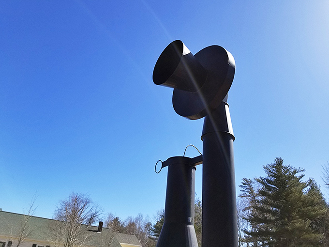 Looking up at the telephone's receiver creates a dramatic perspective, highlighting the impressive craftsmanship of this whimsical roadside attraction.