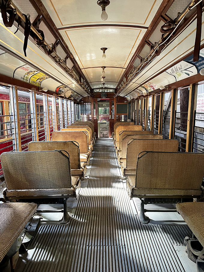 Inside the trolley, polished wood interiors and vintage seating transport visitors to an era when public transportation was crafted with both function and beauty in mind.