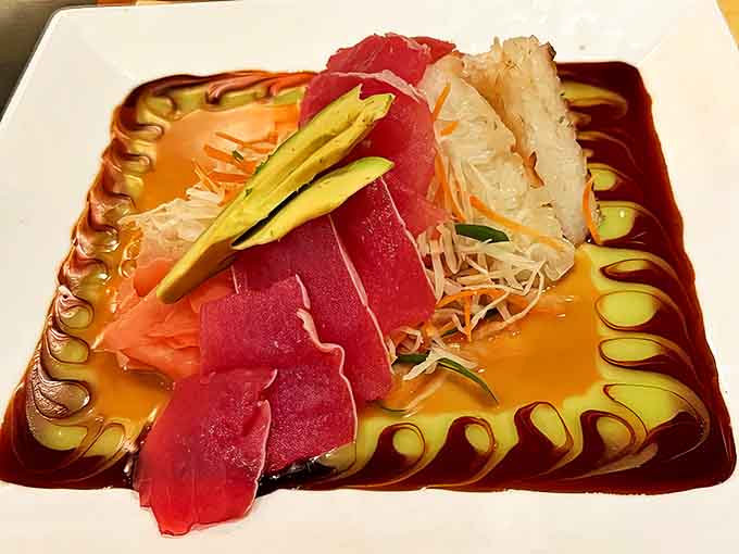 Fresh tuna sashimi arranged like a watercolor painting &ndash; where the ocean's finest treasures meet artistic presentation and punchy sauces.