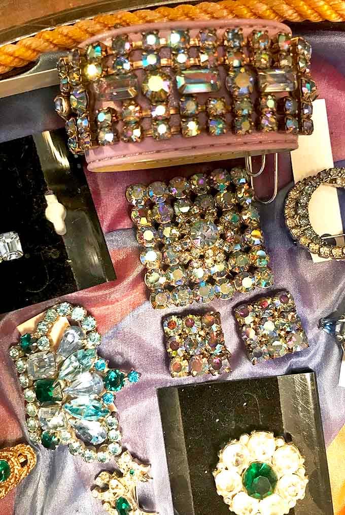 Rhinestones catch the light like tiny stars in this collection of vintage costume jewelry&mdash;each piece a miniature work of art.