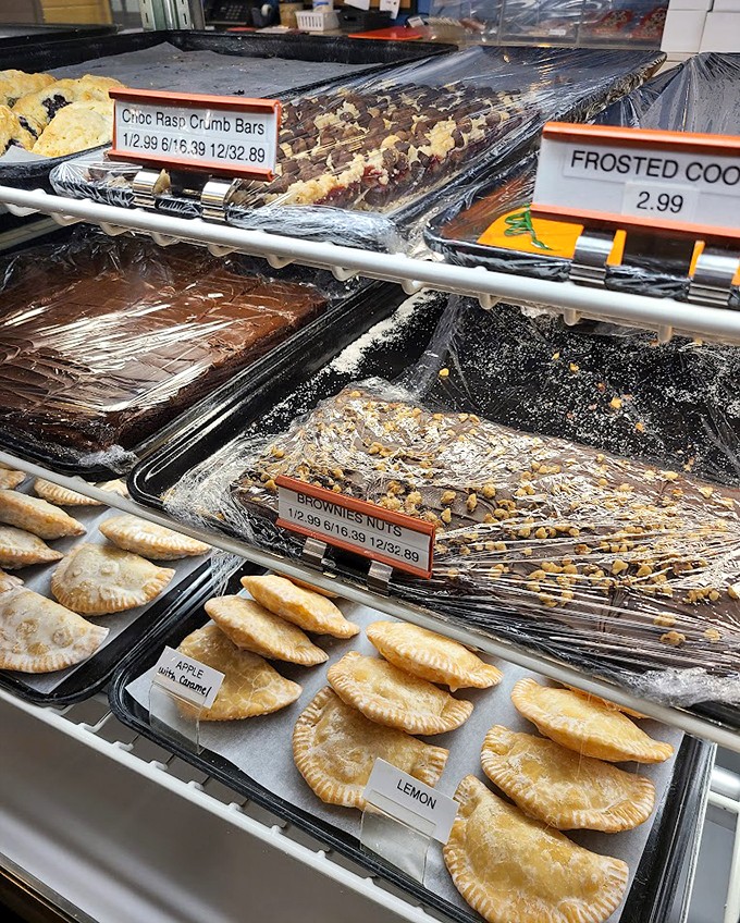 Pastry paradise awaits! From flaky fruit pies to gooey cinnamon rolls, this bakery case is a sweet tooth's dream come true.