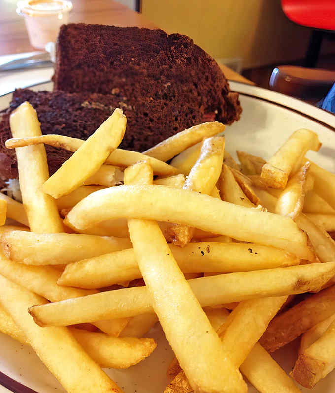 A proper Reuben sandwich alongside golden fries&mdash;proof that simple food done right can outshine any fancy culinary trend.