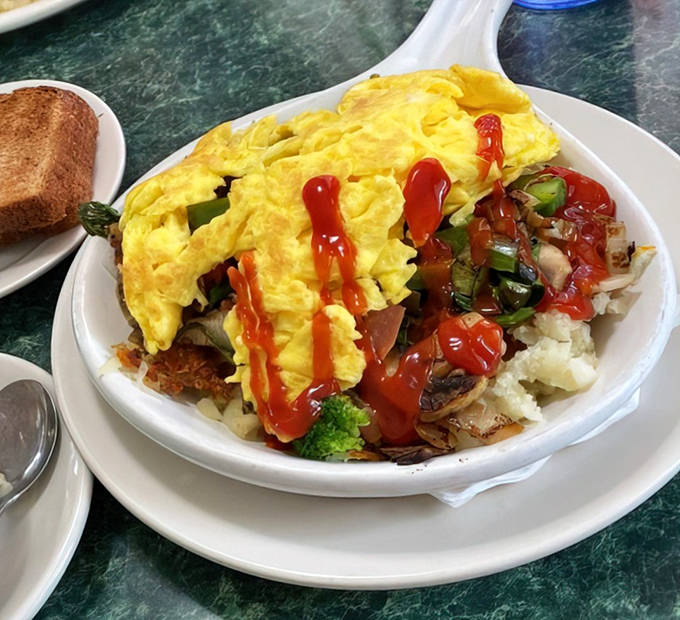 Proof that meat-free can be magnificent, this vegetarian skillet bursts with fresh vegetables and melted cheese over crispy hash browns.
