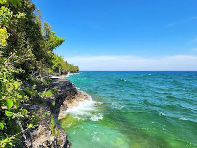 Gentle waves lap at a shore of fine sand. It's like nature's own white noise machine!