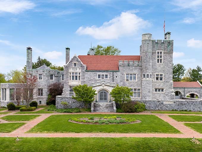 Glamorgan Castle's impressive stone facade and round turrets bring European grandeur to Alliance, Ohio, standing regally behind manicured lawns.
