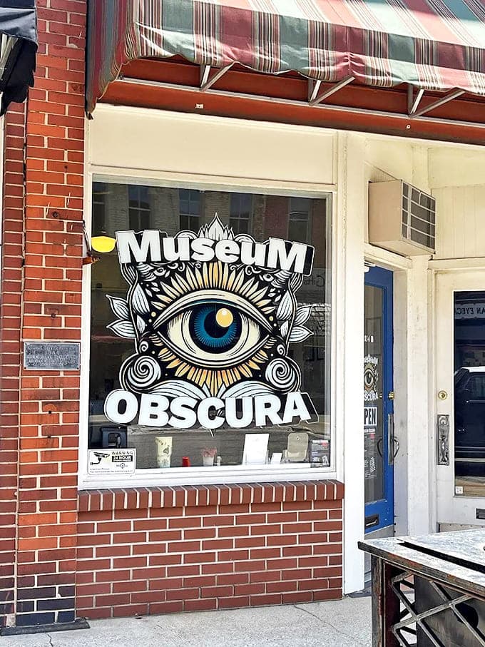 The all-seeing eye logo of Museum Obscura promises visitors a glimpse into the weird and wonderful world of unusual artifacts and oddities.