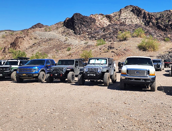 The Desert Bar's parking lot: Where your 4x4's street cred gets a serious boost. No mall crawlers here, folks!