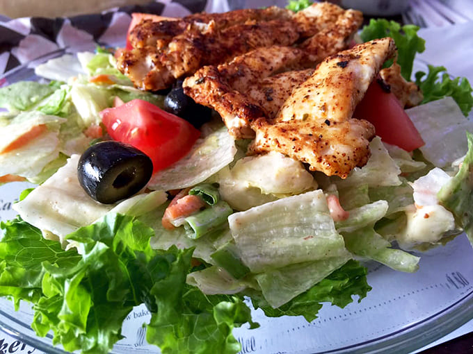 Even the salads get the star treatment here, topped with perfectly grilled chicken and fresh, crisp vegetables.