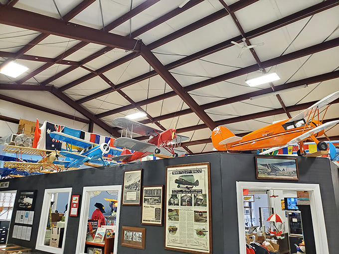 International flags flutter above the exhibits, reminding visitors that aviation has always connected cultures and countries across impossible distances.