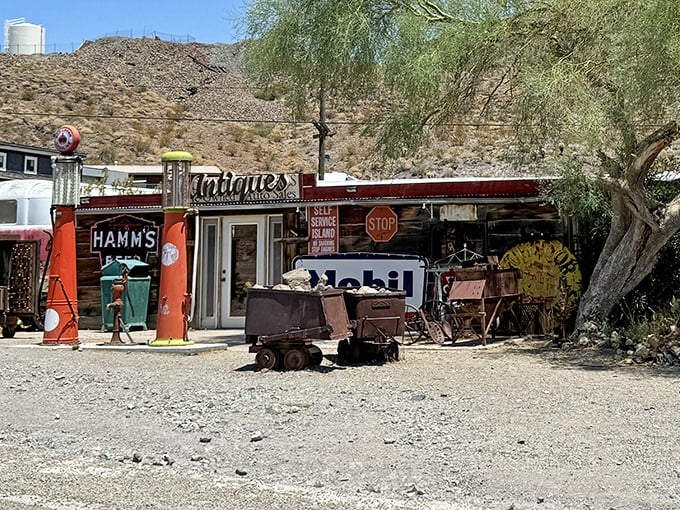 Vintage gas pumps and mining carts tell silent stories outside this antique shop, where yesterday's necessities become today's treasures.