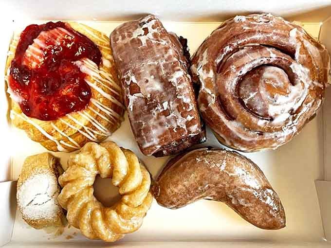 A box of joy containing more happiness than should legally fit in such a small container. Diet starts tomorrow, obviously.