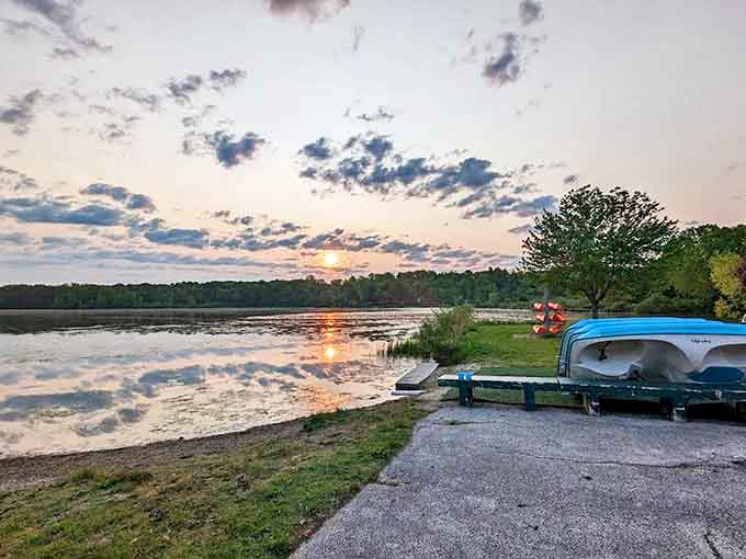 Golden hour transforms Sunny Lake into a painter's palette, with boats silhouetted against the day's final dramatic light show.