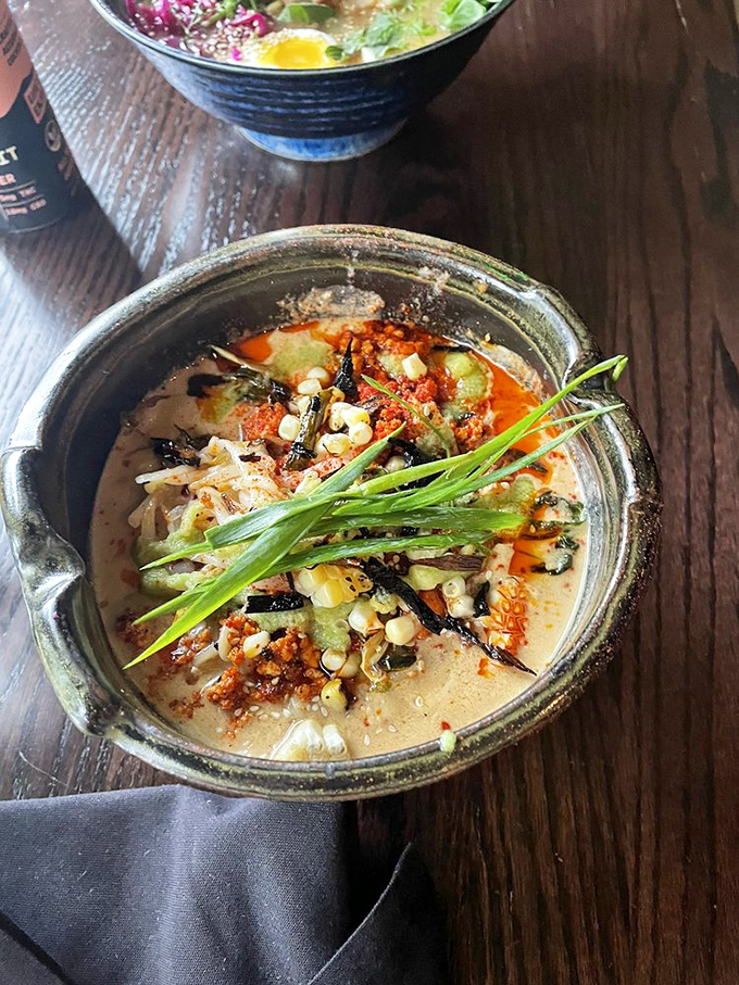 The Korean-inspired ramen brings heat and depth with vibrant toppings that add both visual appeal and layers of complex flavor.