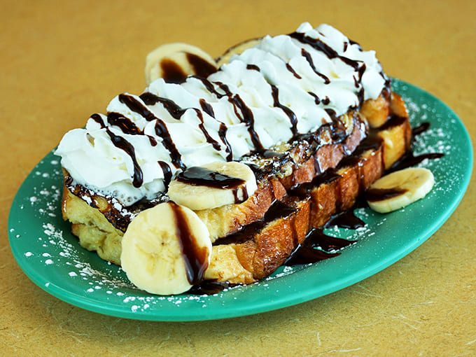 Nutella-stuffed French toast with bananas and chocolate drizzle&mdash;because sometimes breakfast should feel like you're getting away with something deliciously naughty.