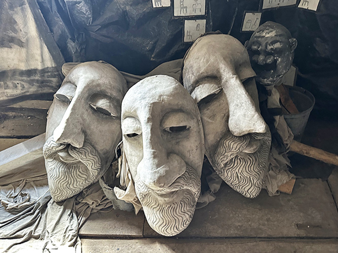These weathered bearded masks could be ancient philosophers or modern prophets, their expressions frozen in perpetual contemplation.