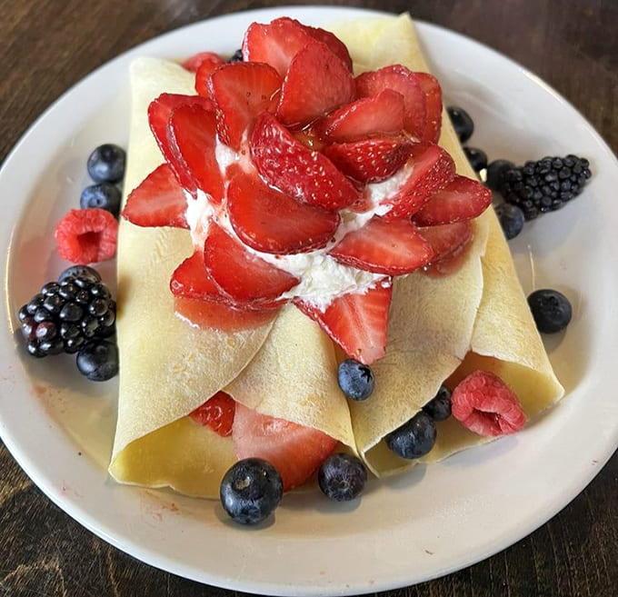 Delicate crepes folded around fresh berries and cream create a dish that's fancy enough for brunch, easy enough to justify for breakfast.