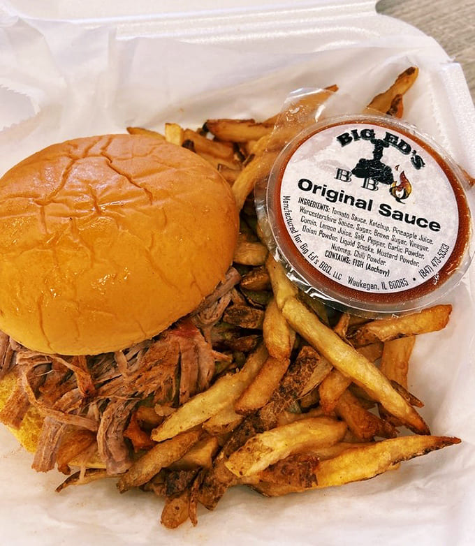 Pulled pork piled high on a bun with fries scattered around like delicious confetti, this is handheld happiness that requires extra napkins and zero regrets.