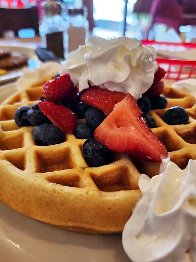 A waffle topped with fresh berries and whipped cream proves that Big House Caf&eacute; doesn't play favorites between sweet and savory.
