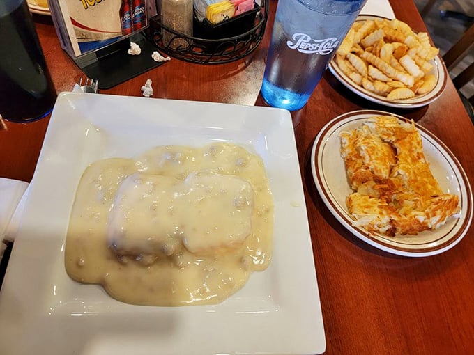 Fluffy biscuits swimming in peppery gravy &ndash; it's like a warm, comforting hug for your taste buds!