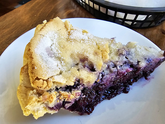 Blueberry pie with a dusting of sugar like fresh Vermont snow. The perfect balance of sweet and tart that makes your taste buds do a happy dance.