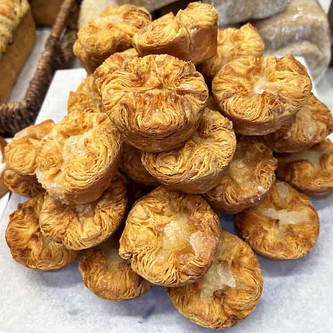 Kouign Amann: the Breton pastry that's basically caramelized butter in architectural form, and yes, it's incredible.