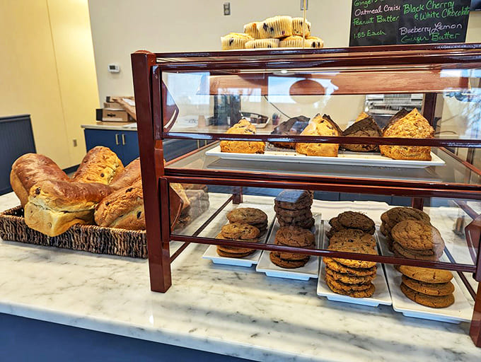 A pastry lover's paradise where each shelf offers a different path to happiness, from crusty breads to delicate sweets.