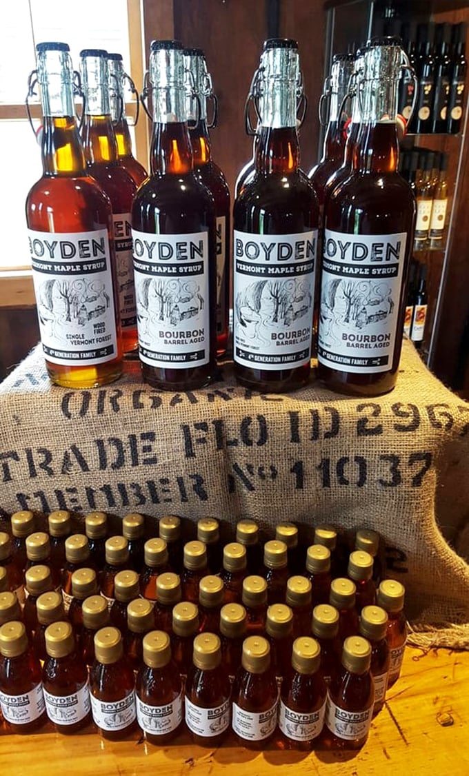 Bourbon barrel-aged maple syrup bottles stand like amber soldiers, representing the delicious intersection of Vermont tradition and innovative craftsmanship.