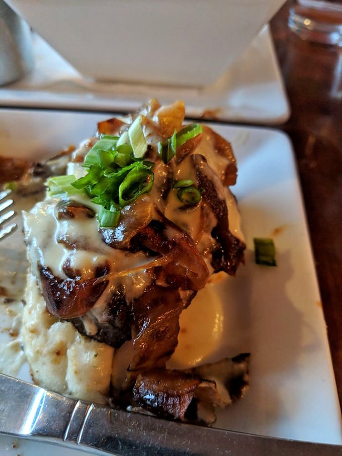 Fork-tender braised short rib resting on cloud-like garlic mashed potatoes &ndash; comfort food elevated to an art form that warms both belly and soul.