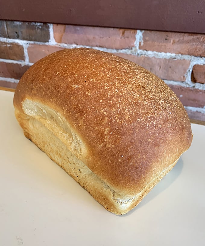 A loaf of bread so perfectly golden-brown it deserves its own art gallery. The crust practically whispers promises of sandwich perfection.