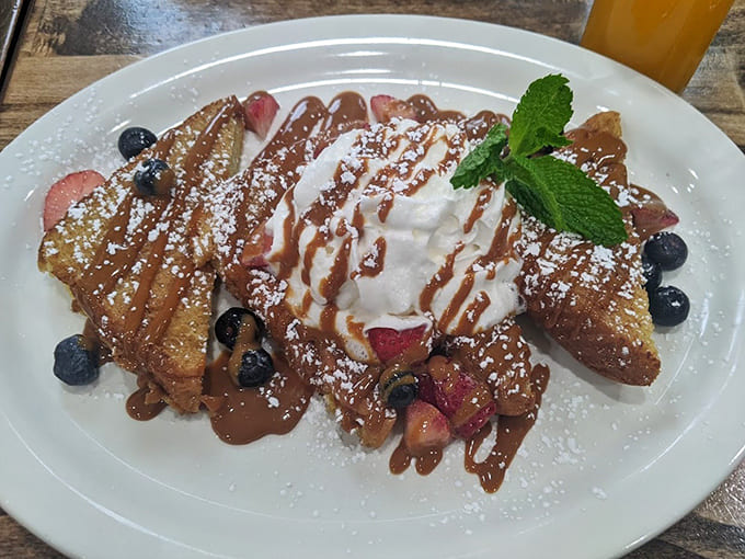 French toast that achieves crispy-yet-custardy perfection, drizzled with enough sweetness to make your dentist nervous.