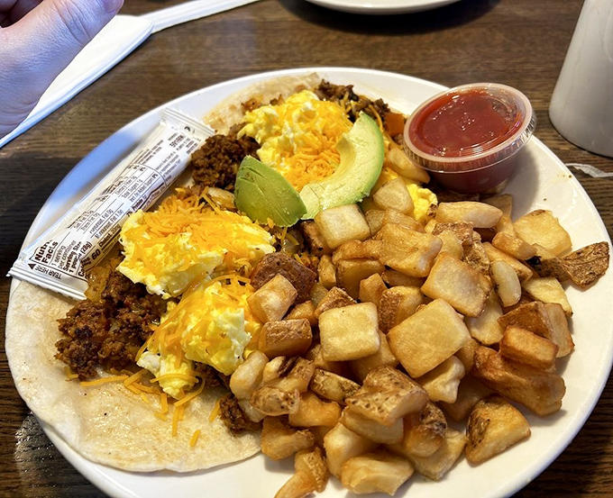 Country gravy cascading over biscuits and sausage creates the kind of breakfast that makes you understand why people write songs about comfort food.