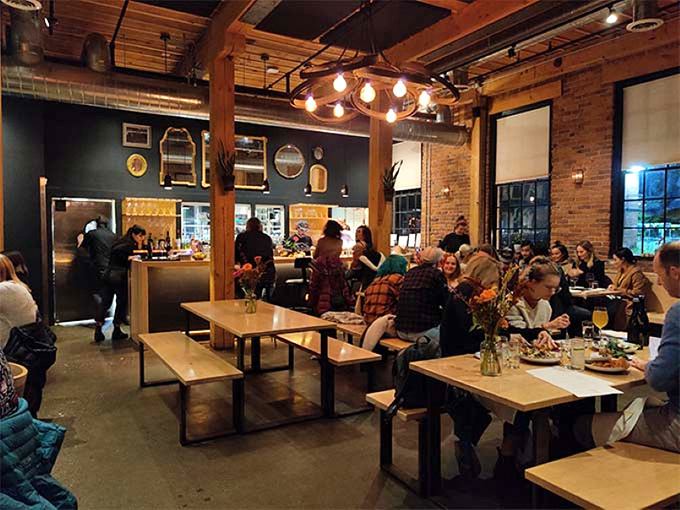 Where Burlington locals gather to break bread and share stories. The warm glow of pendant lights bathes everything in possibility.