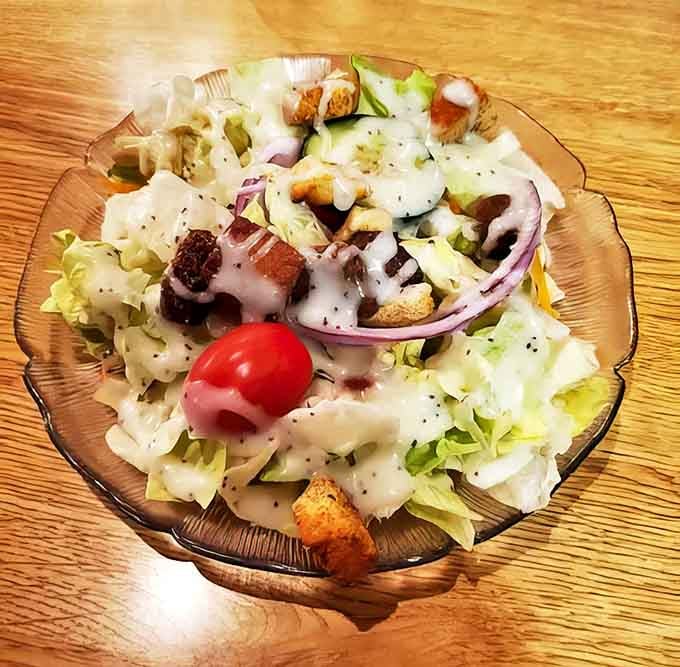 A simple house salad becomes something special with crisp vegetables, house-made croutons, and dressing that complements rather than drowns.