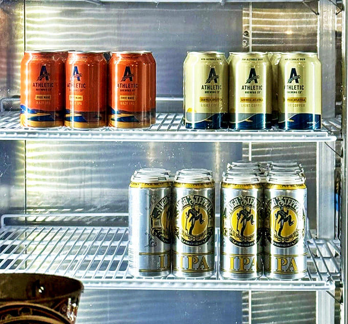 Take the brewery home with you! Crooked Can's colorful canned offerings line refrigerated shelves, ready for your next backyard gathering.