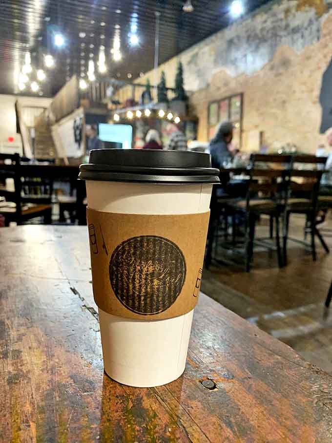 That to-go cup isn't just holding coffee &ndash; it's carrying liquid comfort wrapped in a kraft sleeve bearing the bistro's distinctive logo.